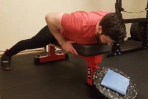 Weighted Lying Neck Extension Exercise Form Guide with Video & Pictures